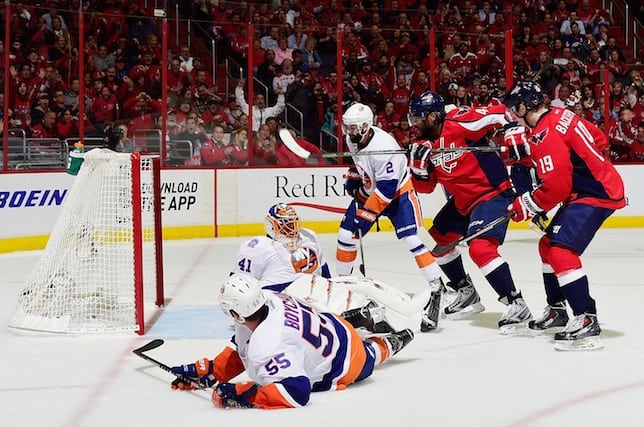 After crazy puck bounce, Isles' Jaroslav Halak juts out right pad to ...