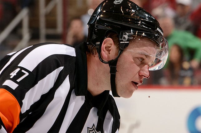 The perils of NHL officiating: Referee Trevor Hanson takes puck to face