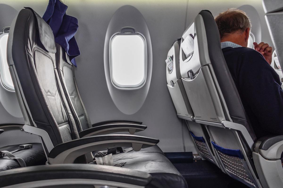 Woman Catches Creepy Airplane Seat Mate Taking Photos of Her in ...