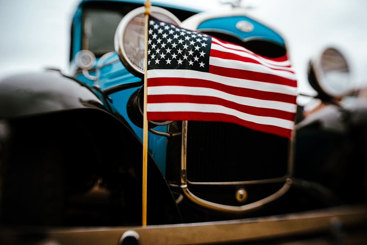Meet the Man Driving a Recliner Chair with an American Flag Canopy and ...